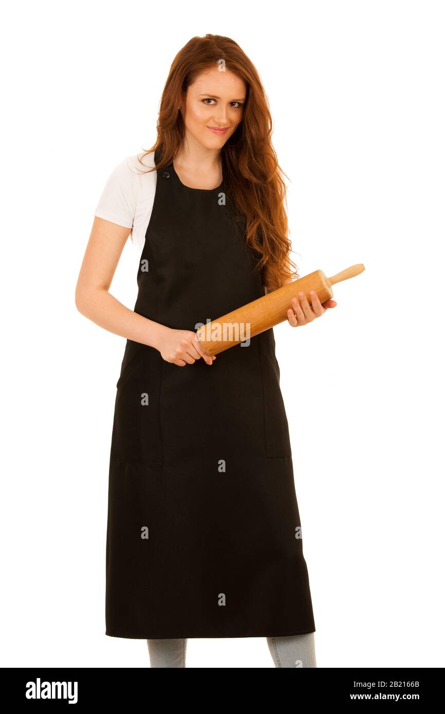 Beautiful baker woman holding a roller isolated over white background ...