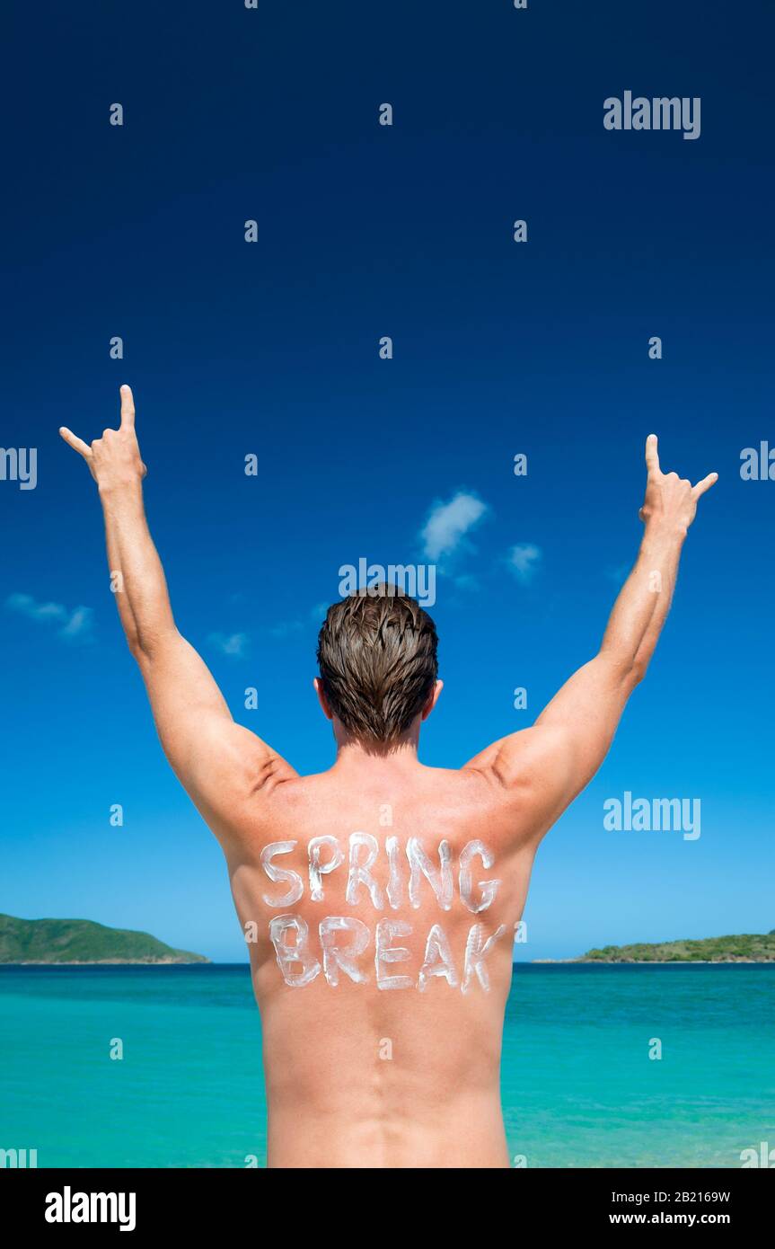 Dude with Spring Break written in sunscreen on his back rocking out ...