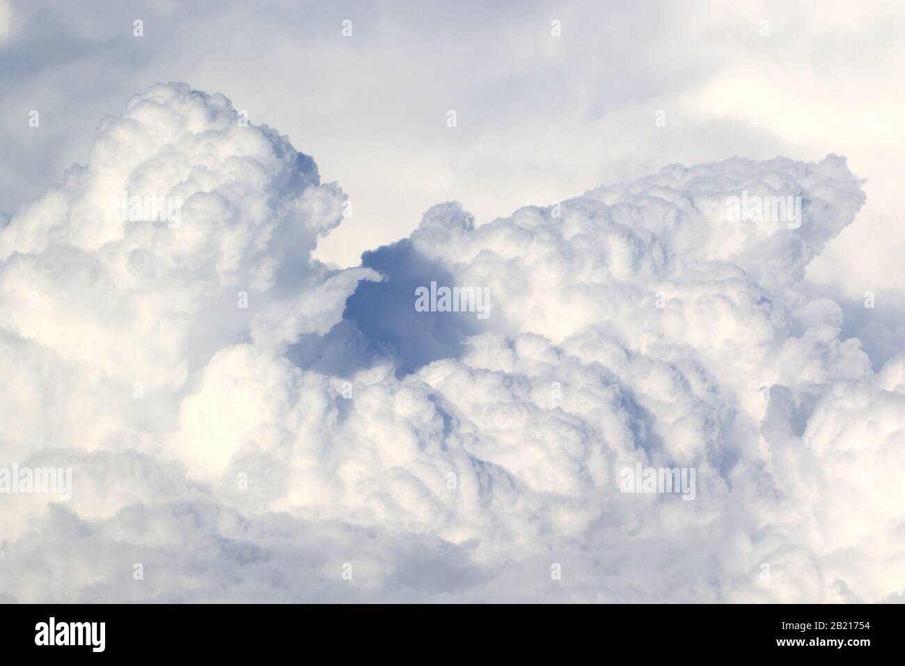Fluffy white clouds in the atmosphere captured from above by a flying ...