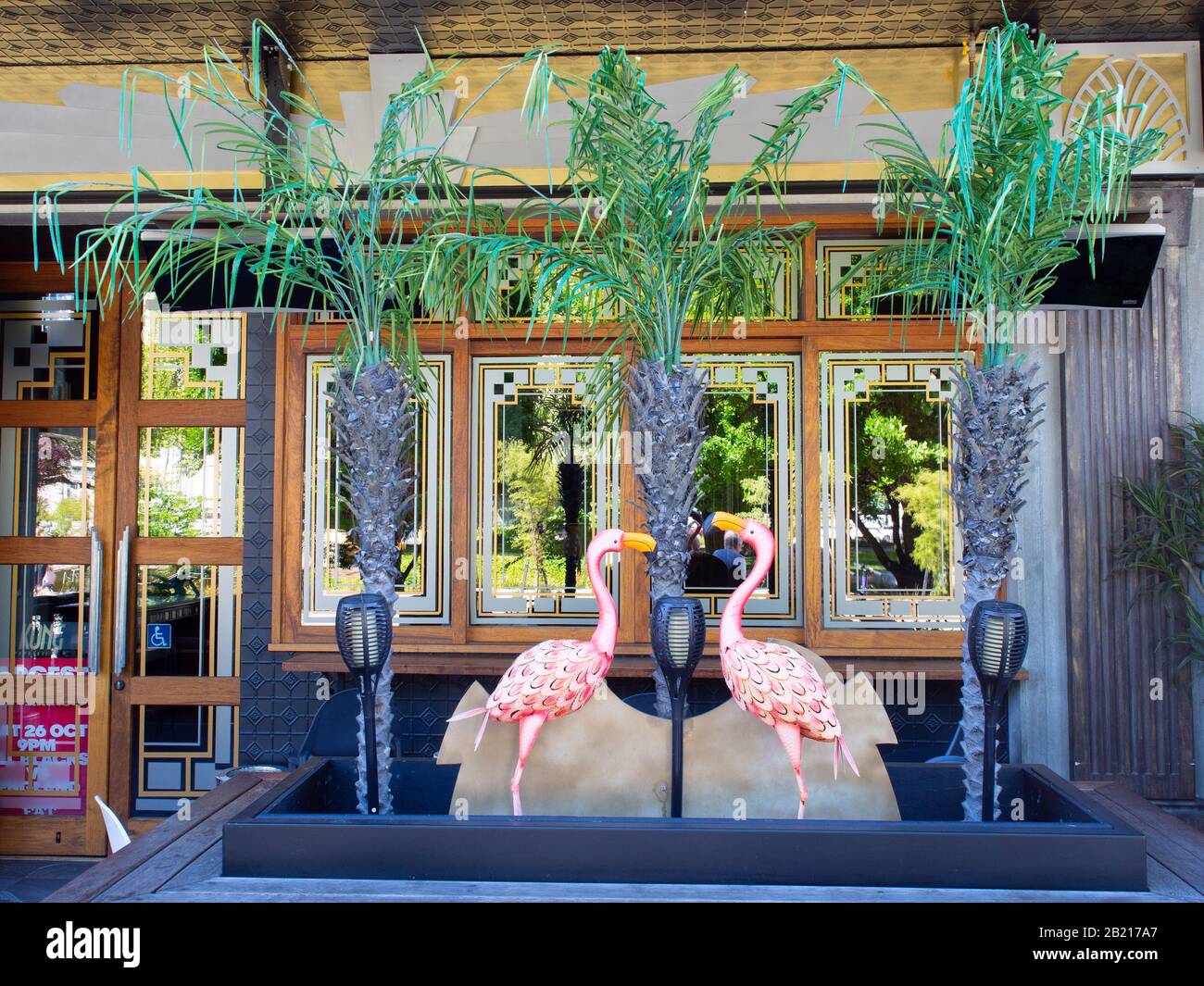 Pink Flamingos And Trees Outside A Restaurant Stock Photo - Alamy