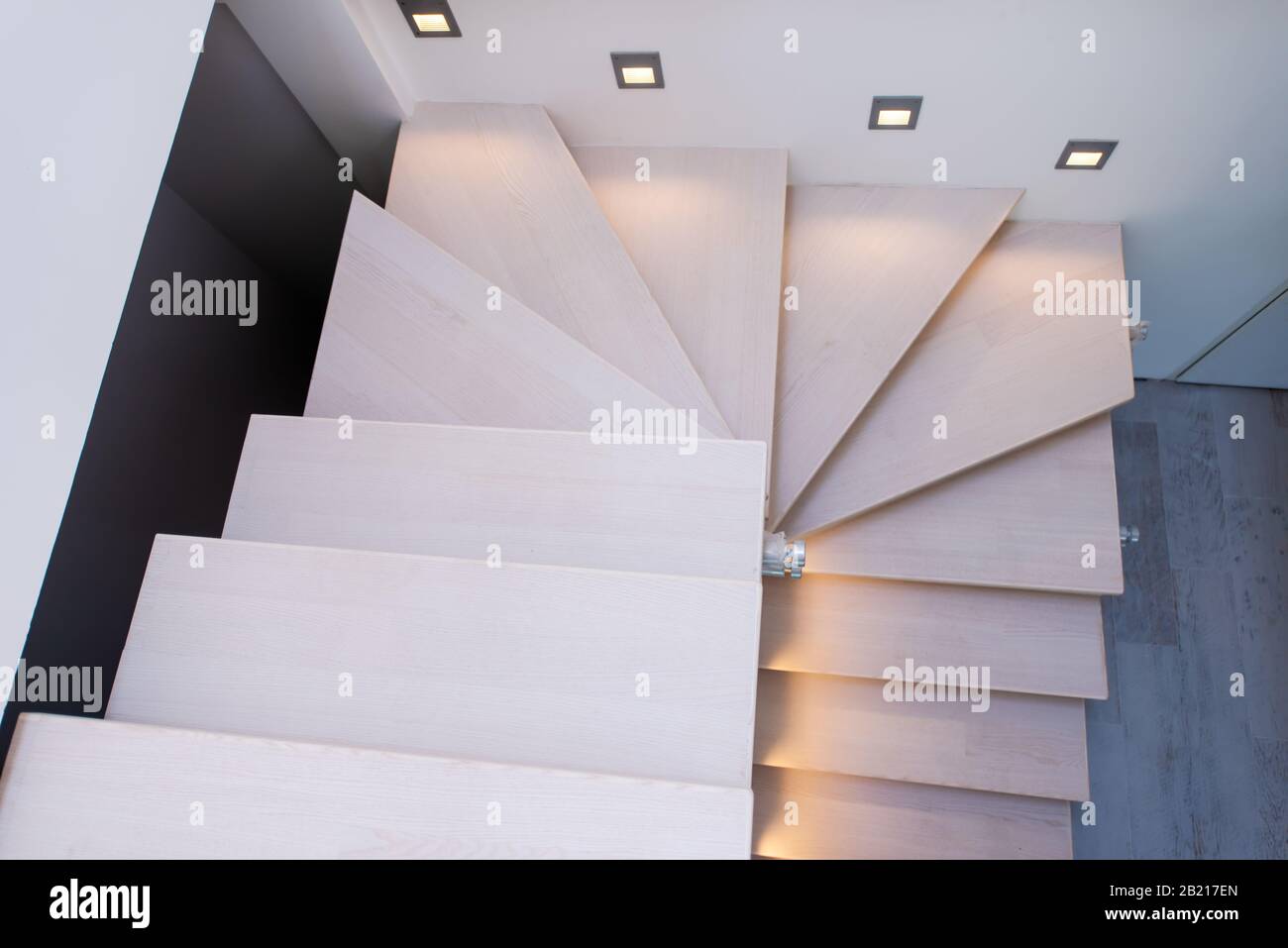 stylish interior with wooden stairs in big modern two level luxury ...