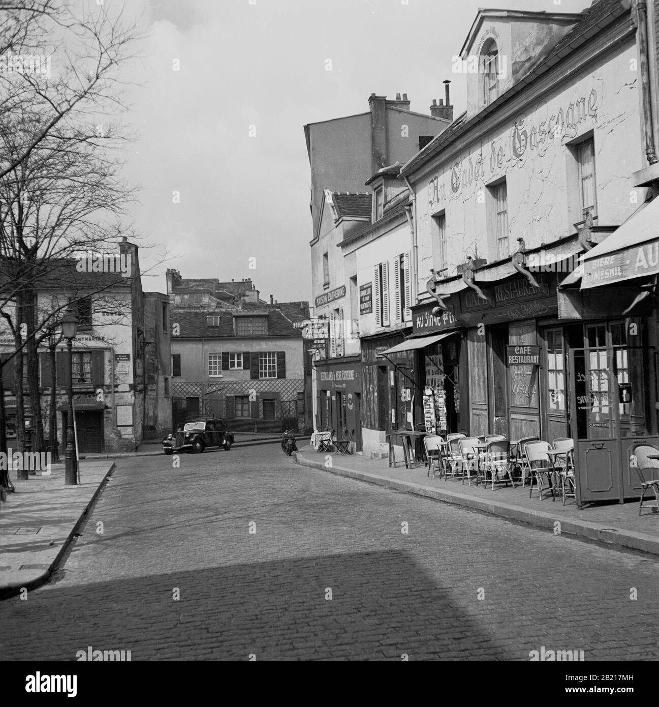 1950s, Paris, France, cobbled street with restaurants beside Place du ...