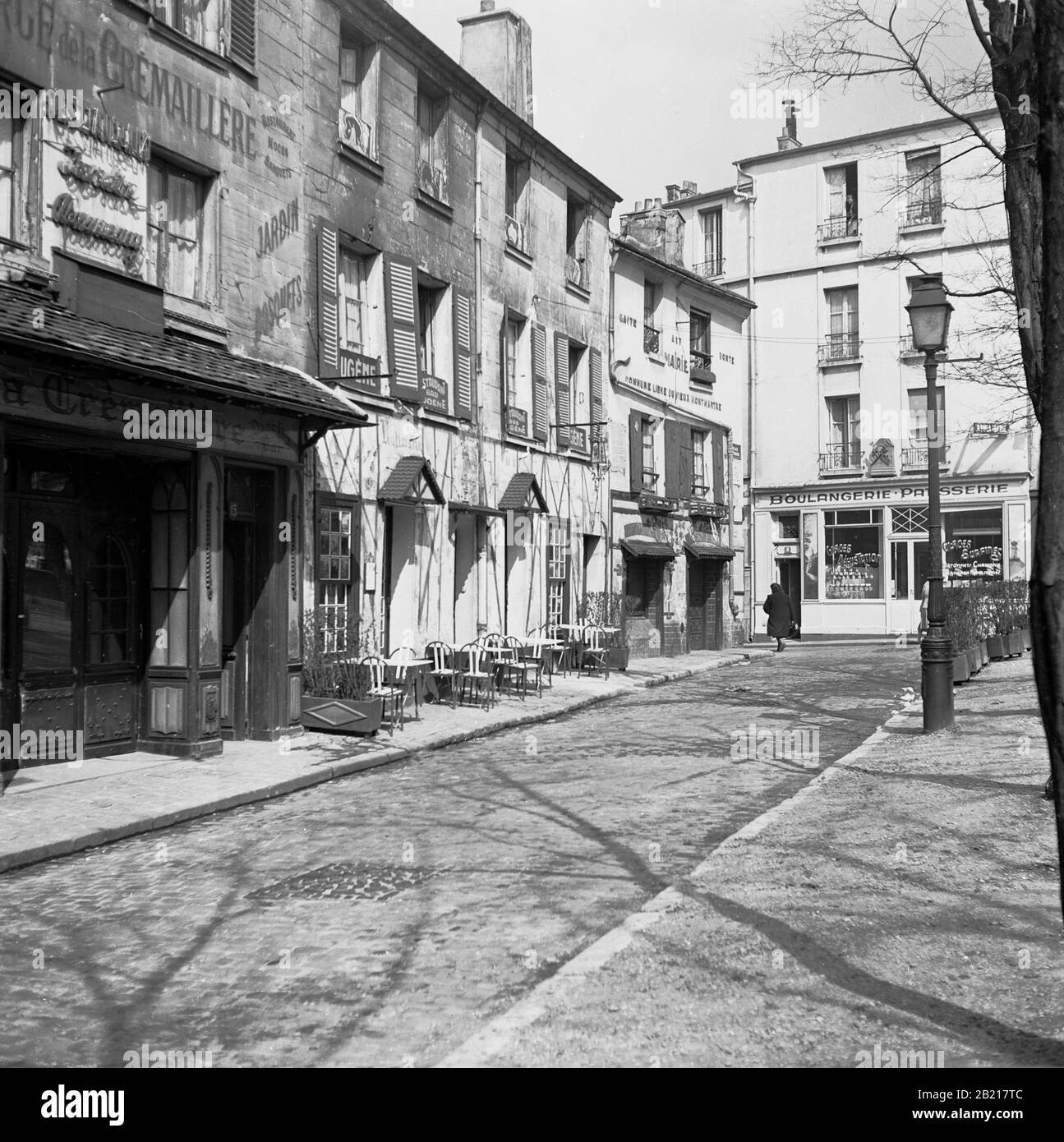 1950s, historucal, narrow cobbled street with restaurants beside the ...