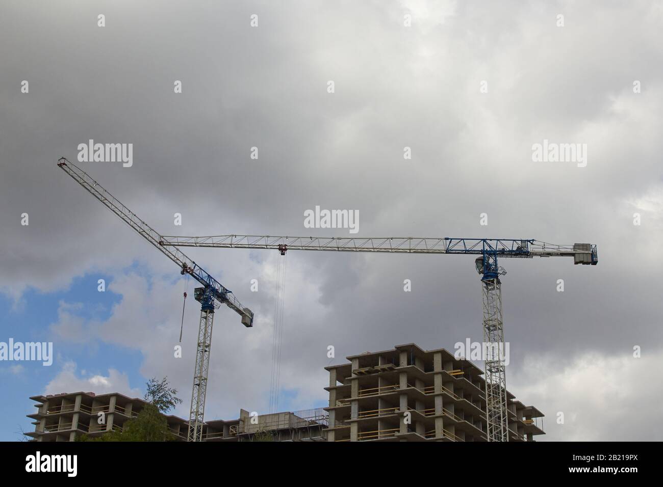 Industrial construction cranes the construction of an building Stock ...