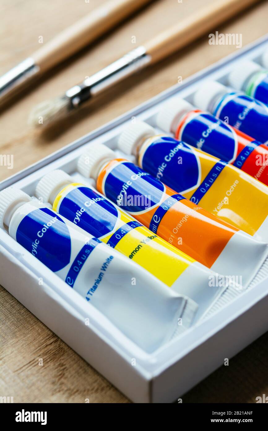 Box with acrylic colors and two brushes Stock Photo - Alamy