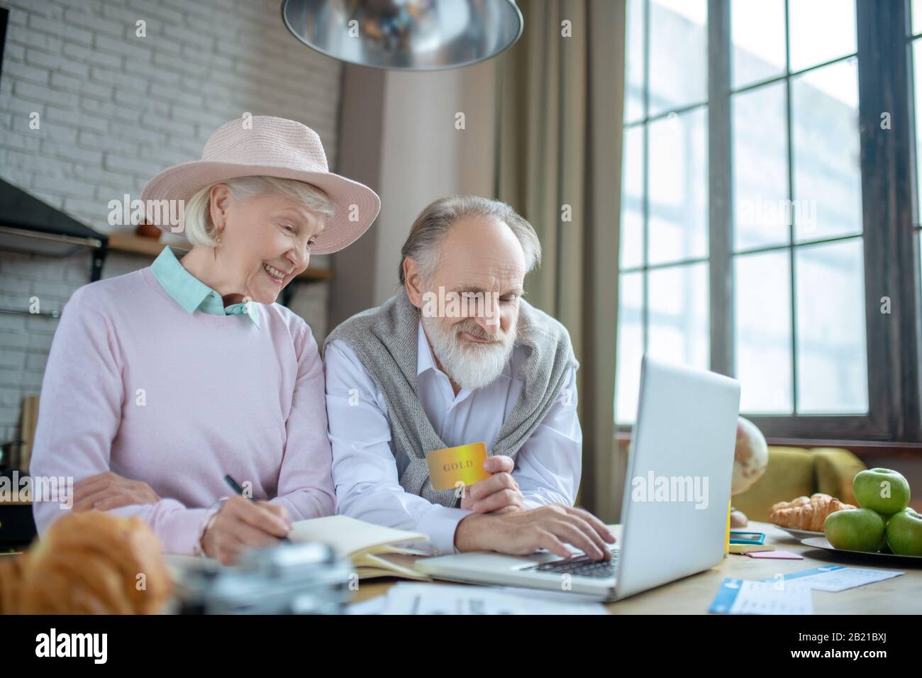 Elderly man and woman using a computer together Stock Photo - Alamy