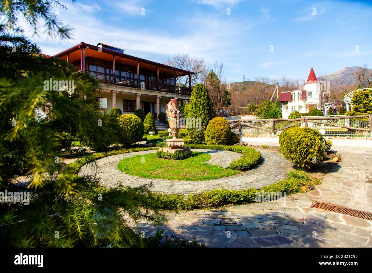 Lawn in the form of a circular maze in the courtyard of the restaurant ...