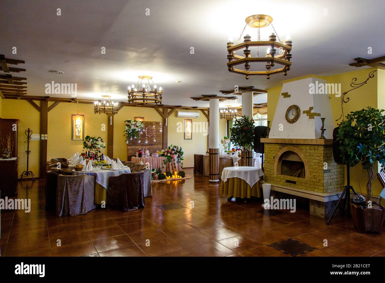 Large restaurant Hall with columns and fireplace. Canned tables. Greek ...