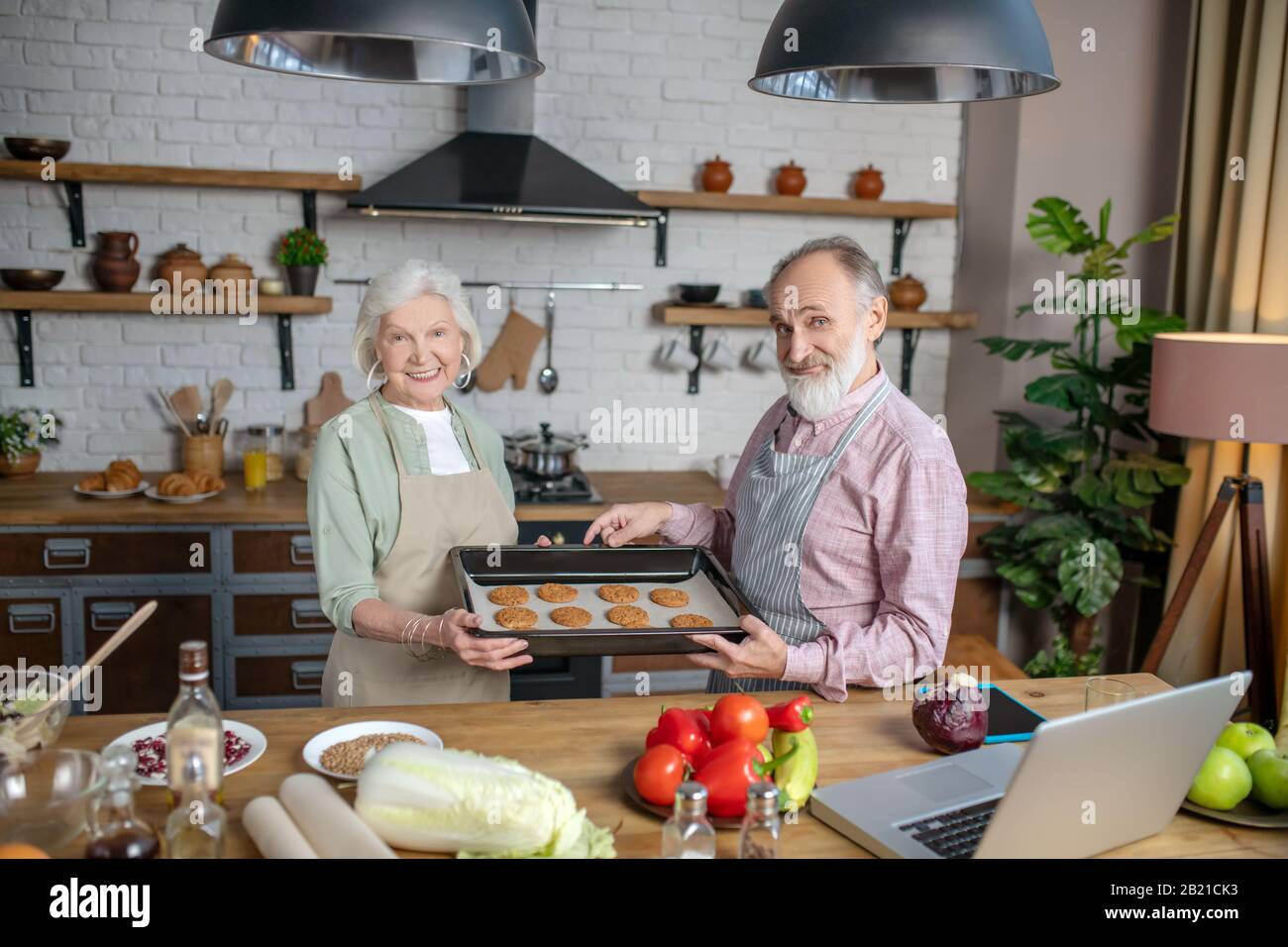 Old woman baking cookies hi-res stock photography and images - Alamy