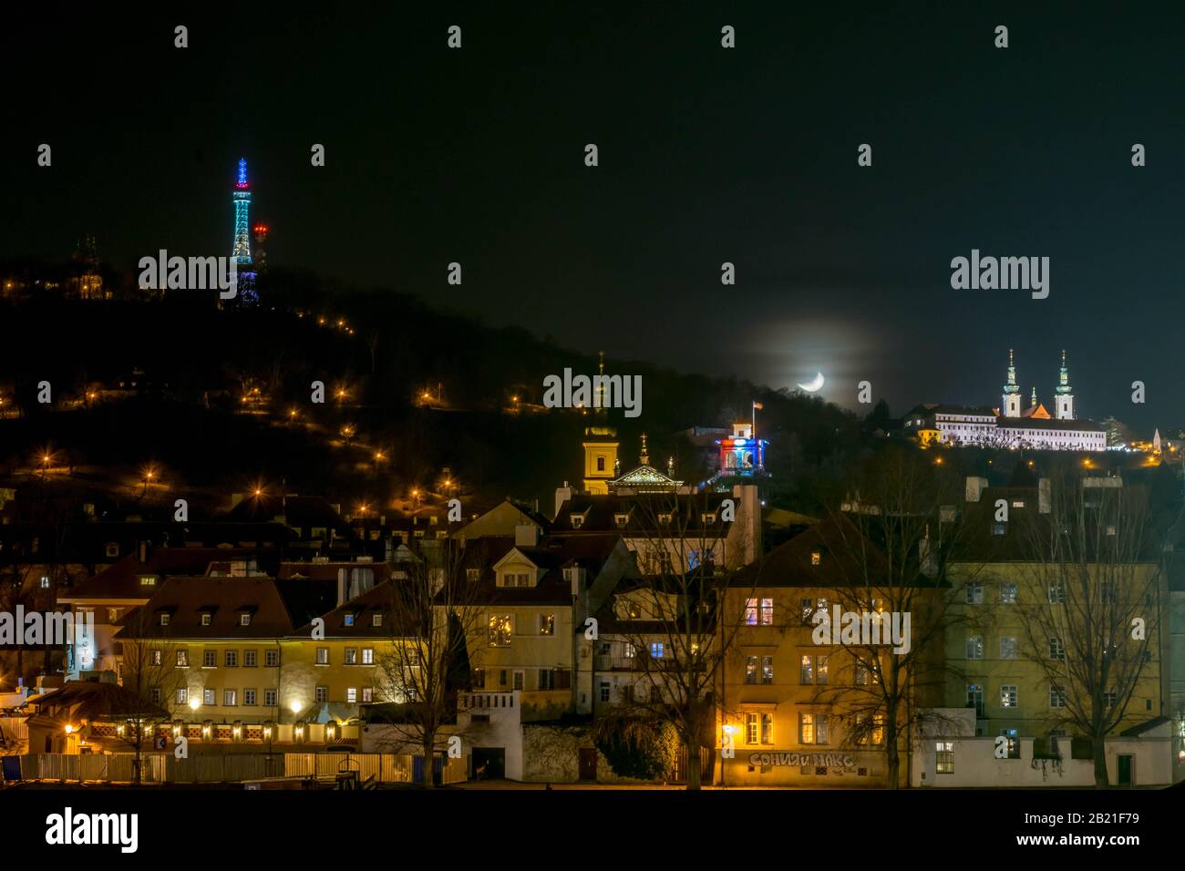 View at Prague and moon at night Stock Photo - Alamy