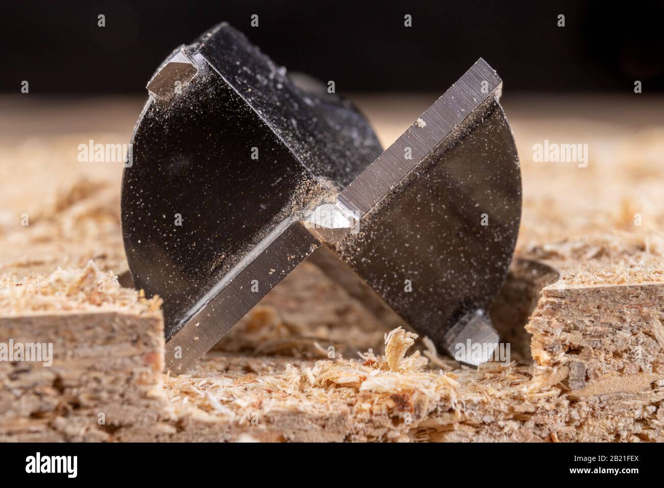 Drilling with a special drill in chipboard. Work in a carpentry ...