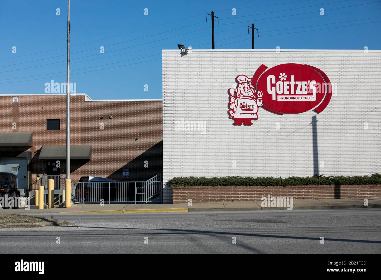 A logo sign outside of the headquarters and factory of the Goetze's ...