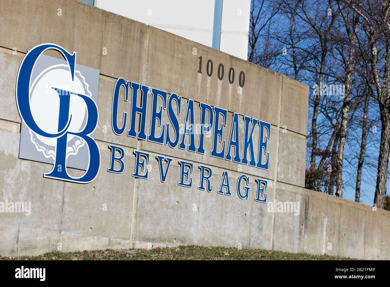 A logo sign outside of a facility occupied by Chesapeake Beverage in ...