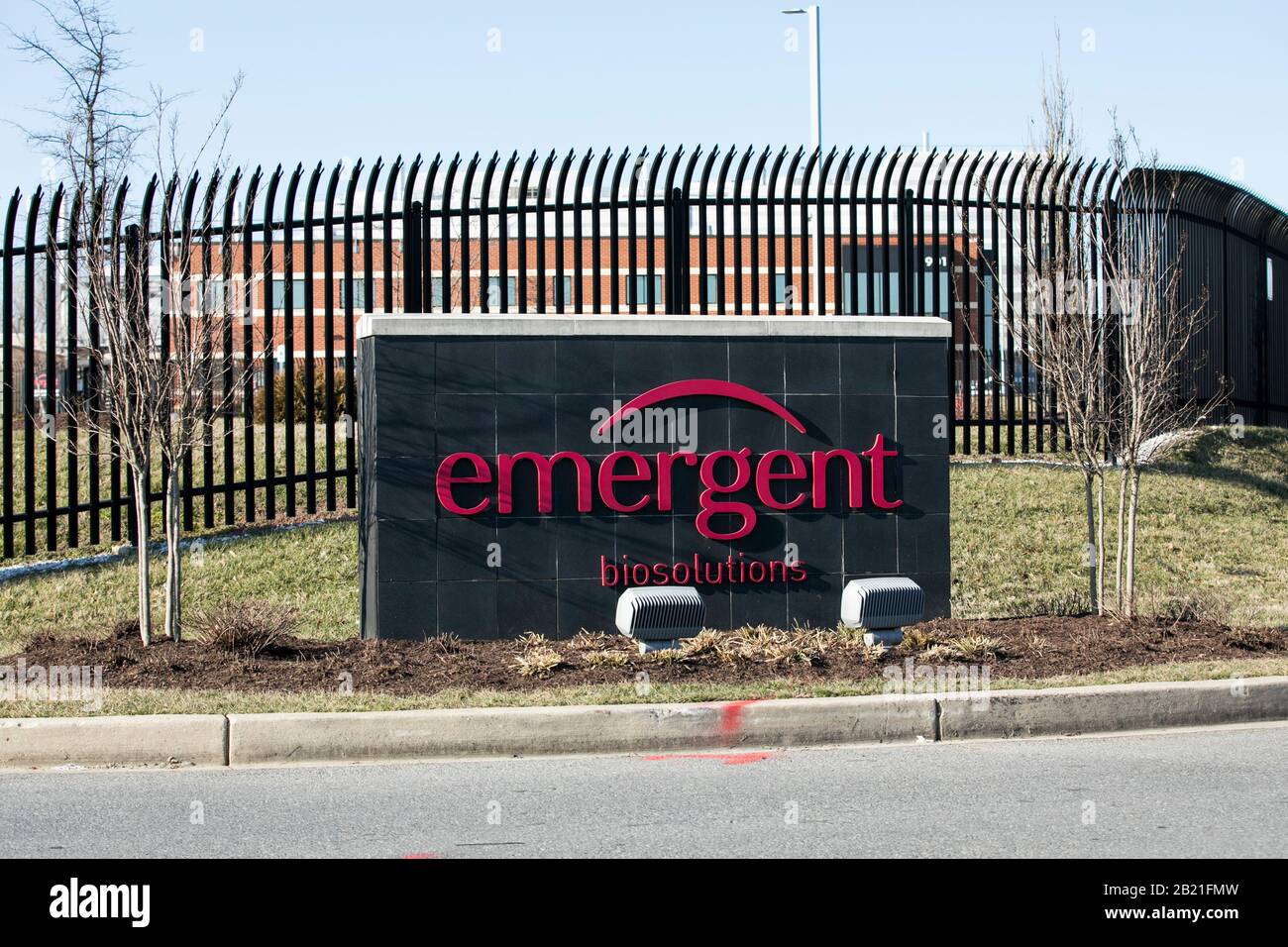A logo sign outside of a facility occupied by Emergent BioSolutions in ...