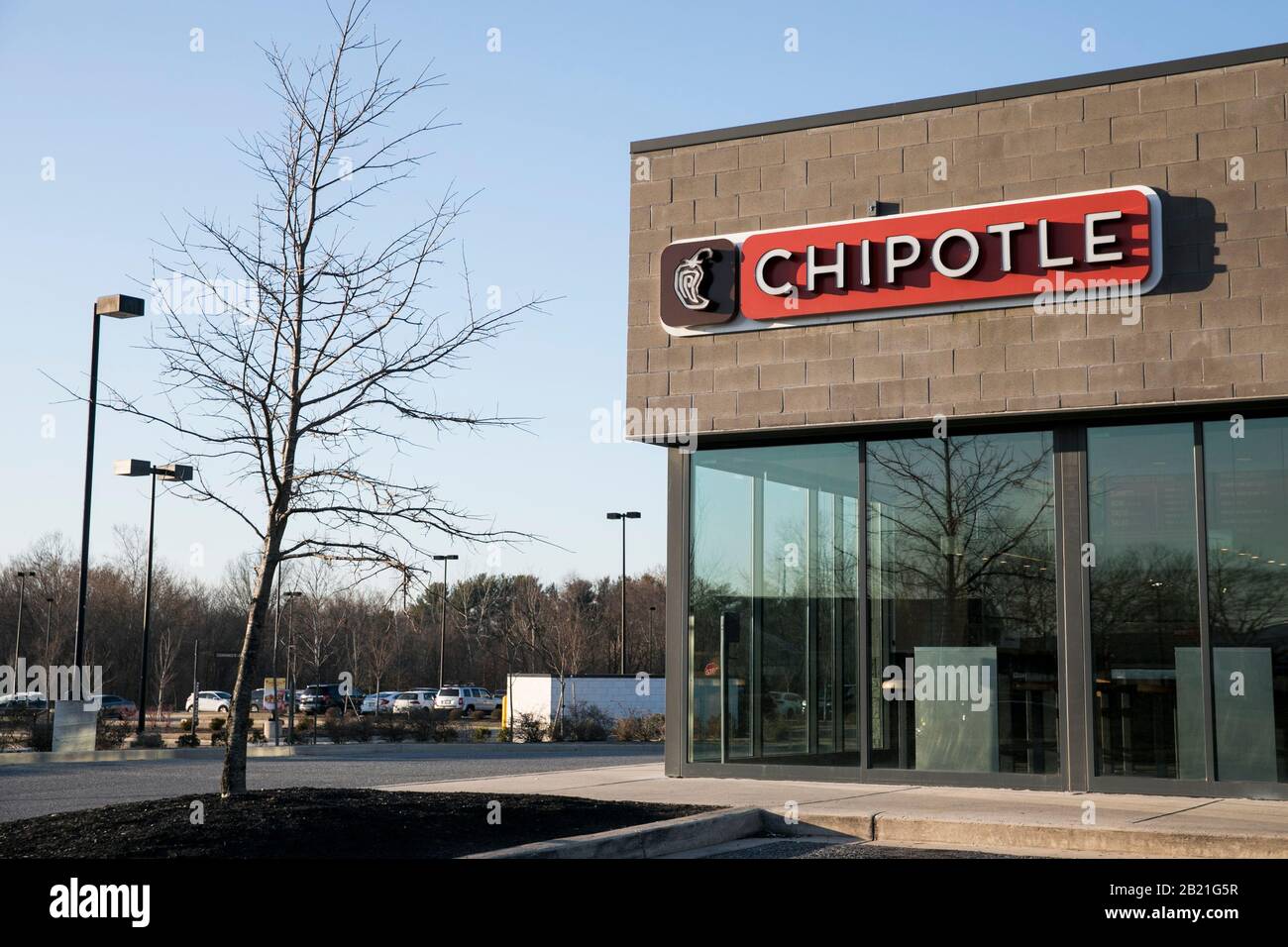 A logo sign outside of a Chipotle restaurant location in Nottingham ...