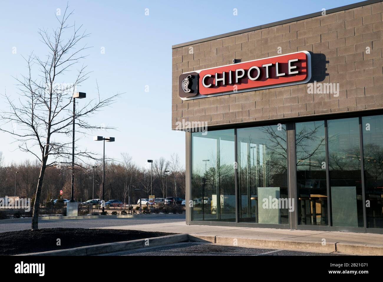 A logo sign outside of a Chipotle restaurant location in Nottingham ...