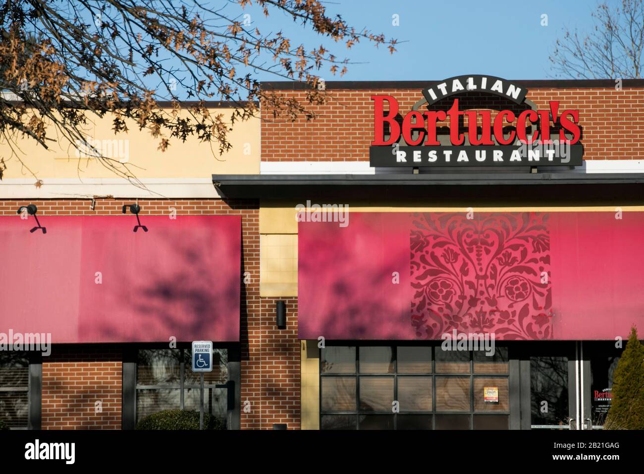 A logo sign outside of Bertucci's restaurant location in Baltimore ...