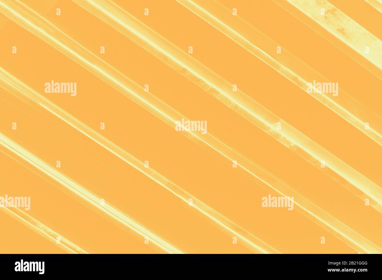 Yellow mustard color background with diagonal light frayed stripes ...