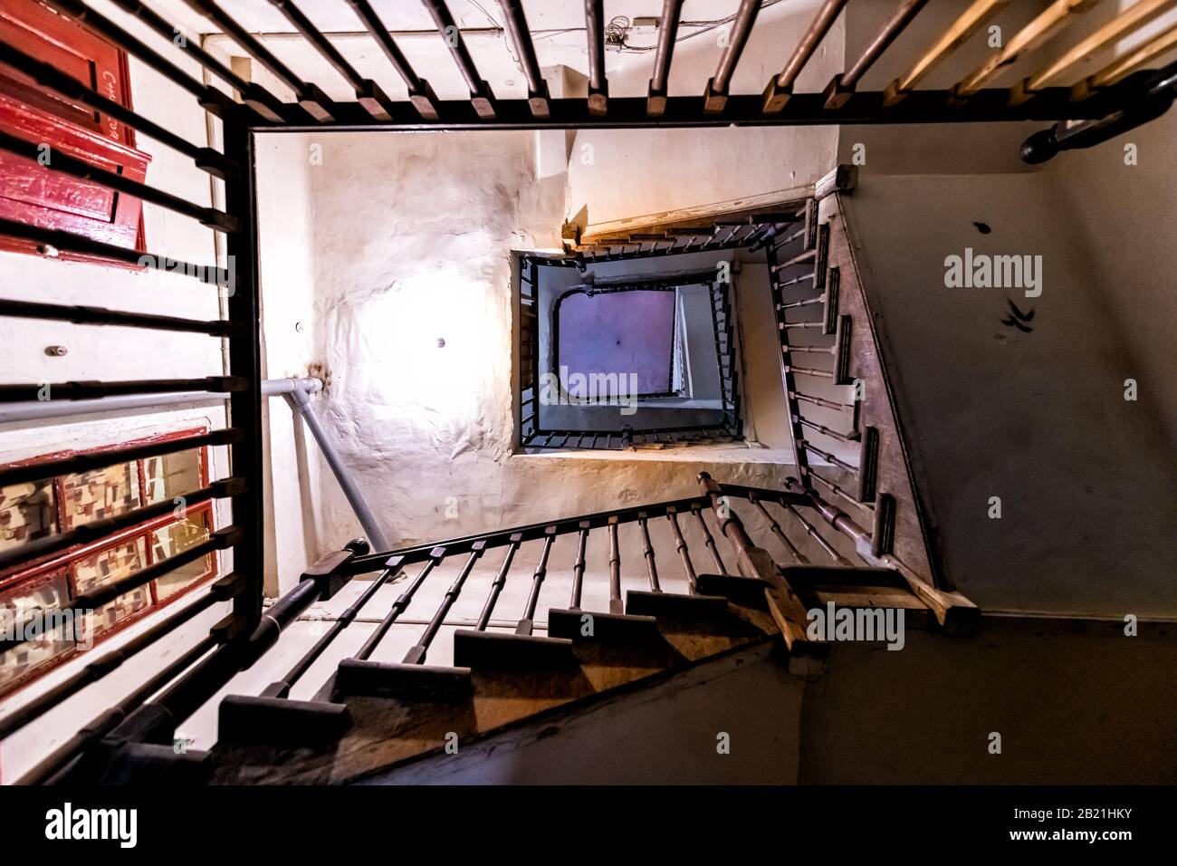 Looking up low angle abstract view of old dark stairway staircase in ...