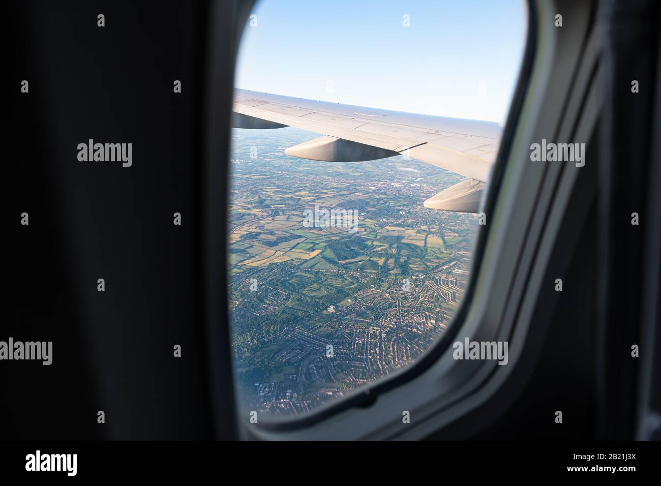 Aerial high angle above view from airplane plane over suburbs outskirts ...