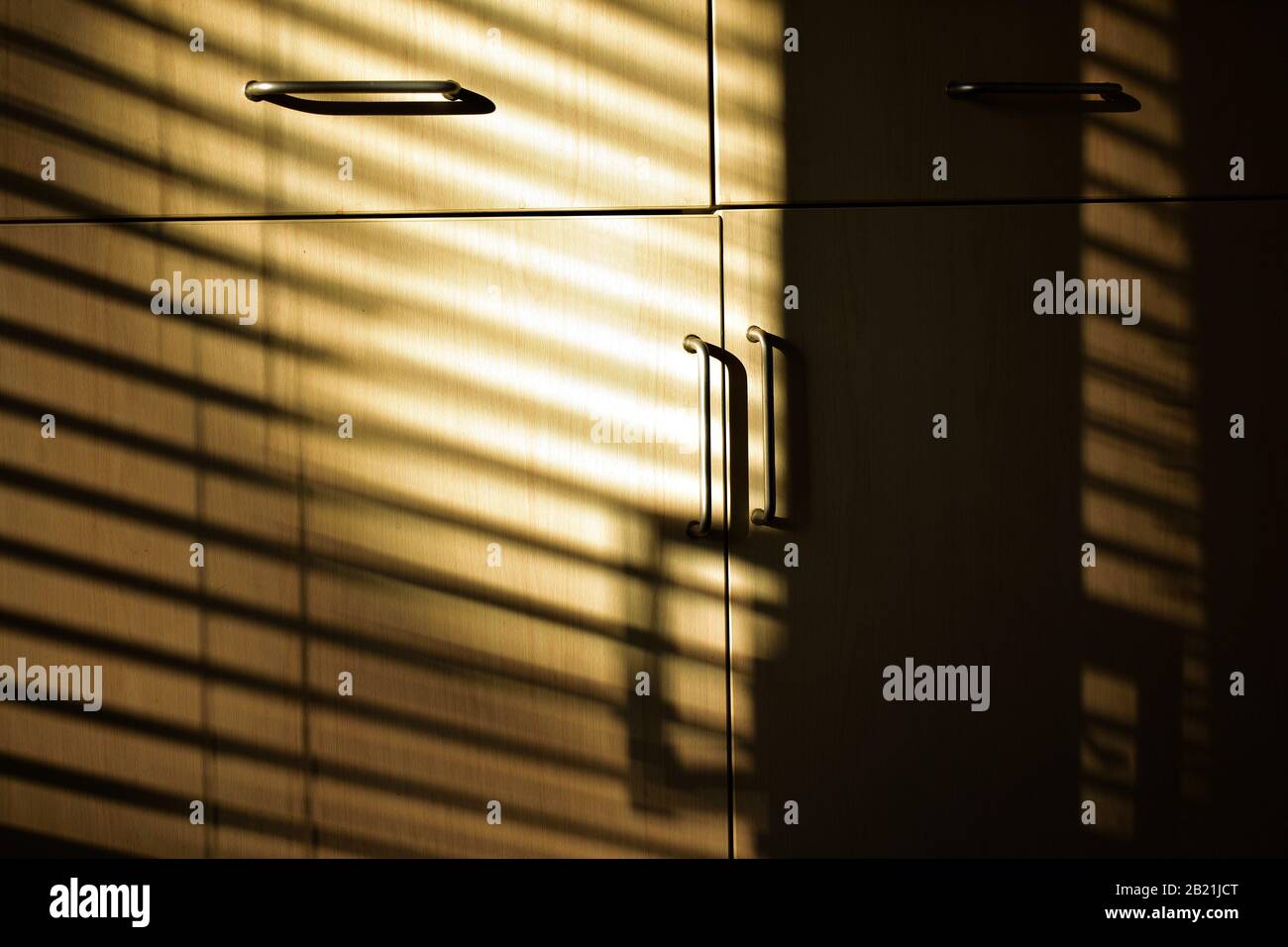 Sunlight streaming through blinds hi-res stock photography and images ...