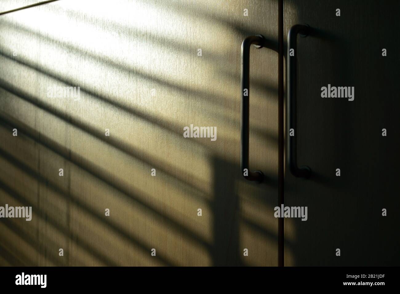Sunlight streaming through blinds hi-res stock photography and images ...