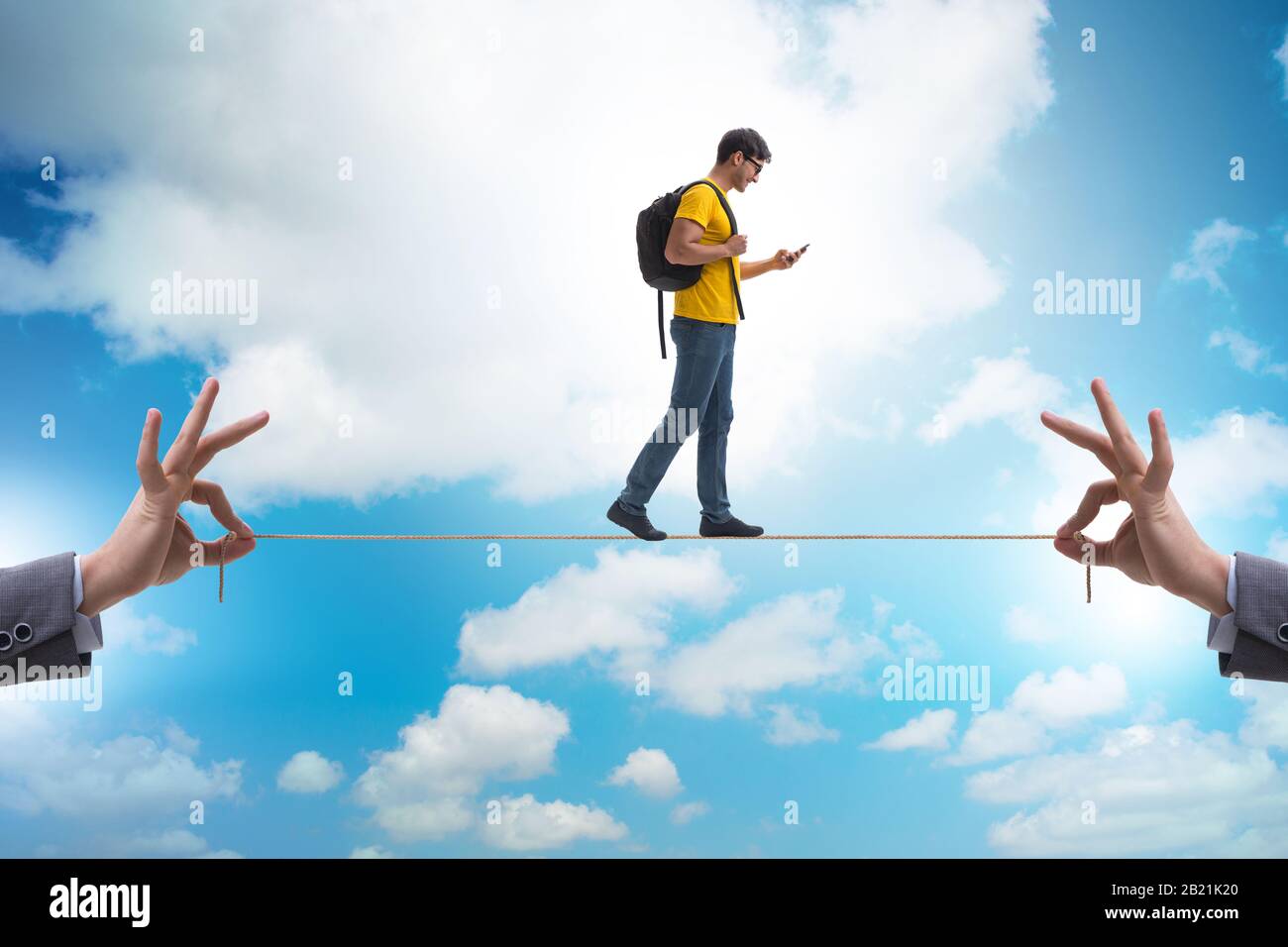 The student walking on tight rope Stock Photo - Alamy