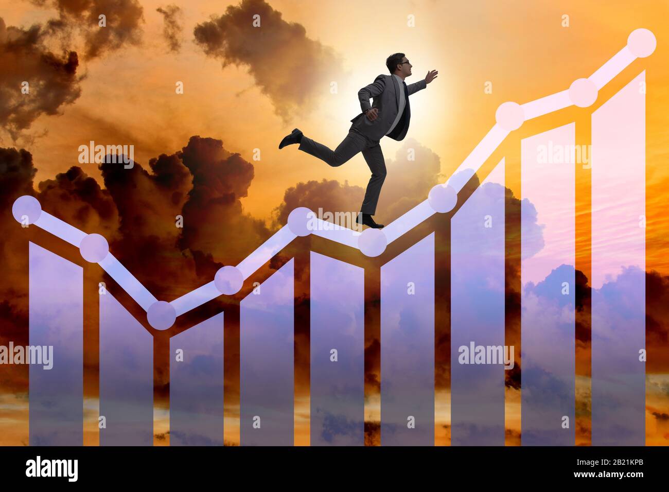 The businessman climbing bar charts in growth concept Stock Photo - Alamy