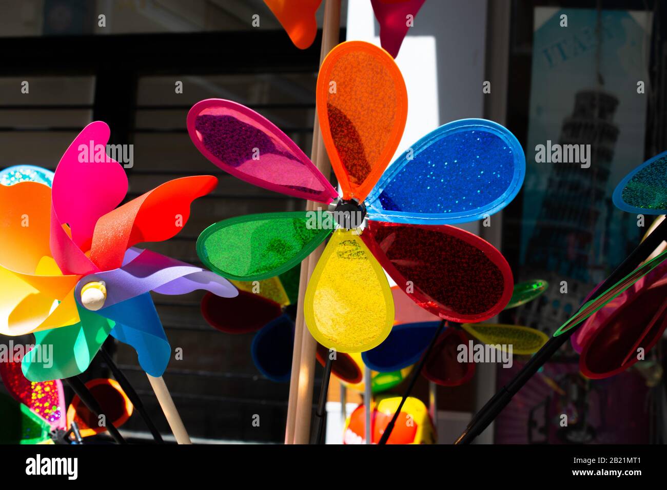 Rainbow colored pinwheels on sale in the view Stock Photo - Alamy