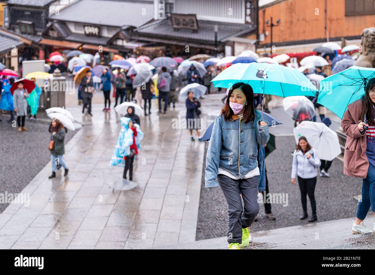 Japanese woman walking up steps hi-res stock photography and images - Alamy