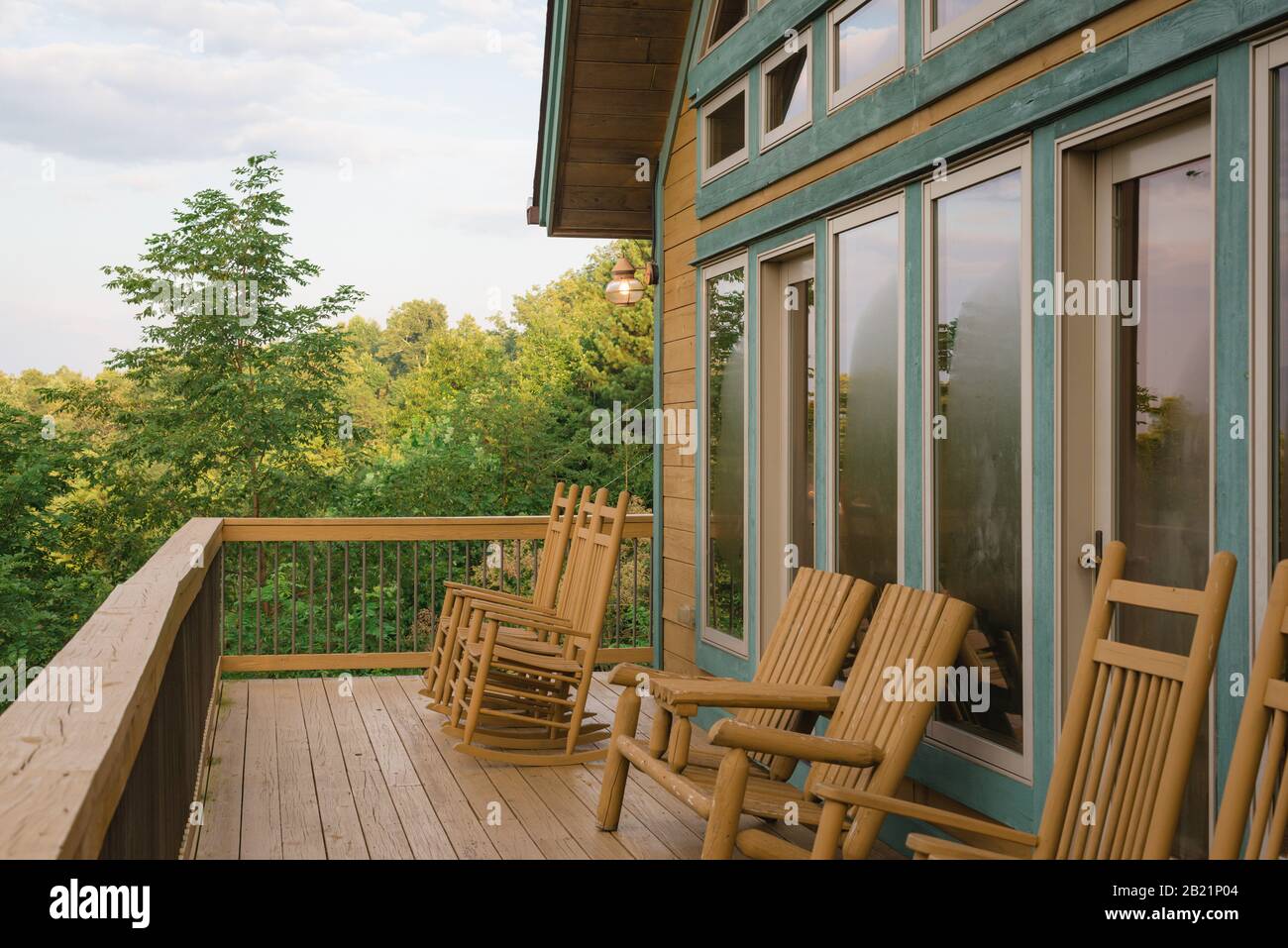 Rocking chairs await guests on this mountain cabin porch near the Smoky ...