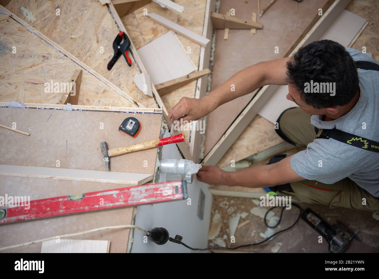 work in progress on stylish interior professional carpenter installing ...