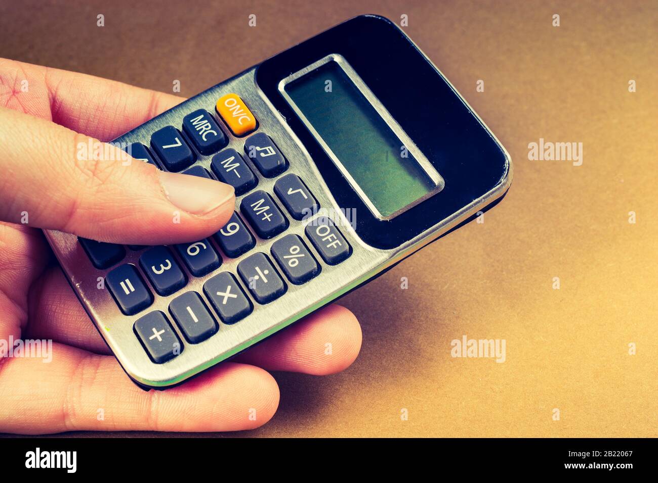 Electronic calculator device with keyboard and display in hand Stock ...