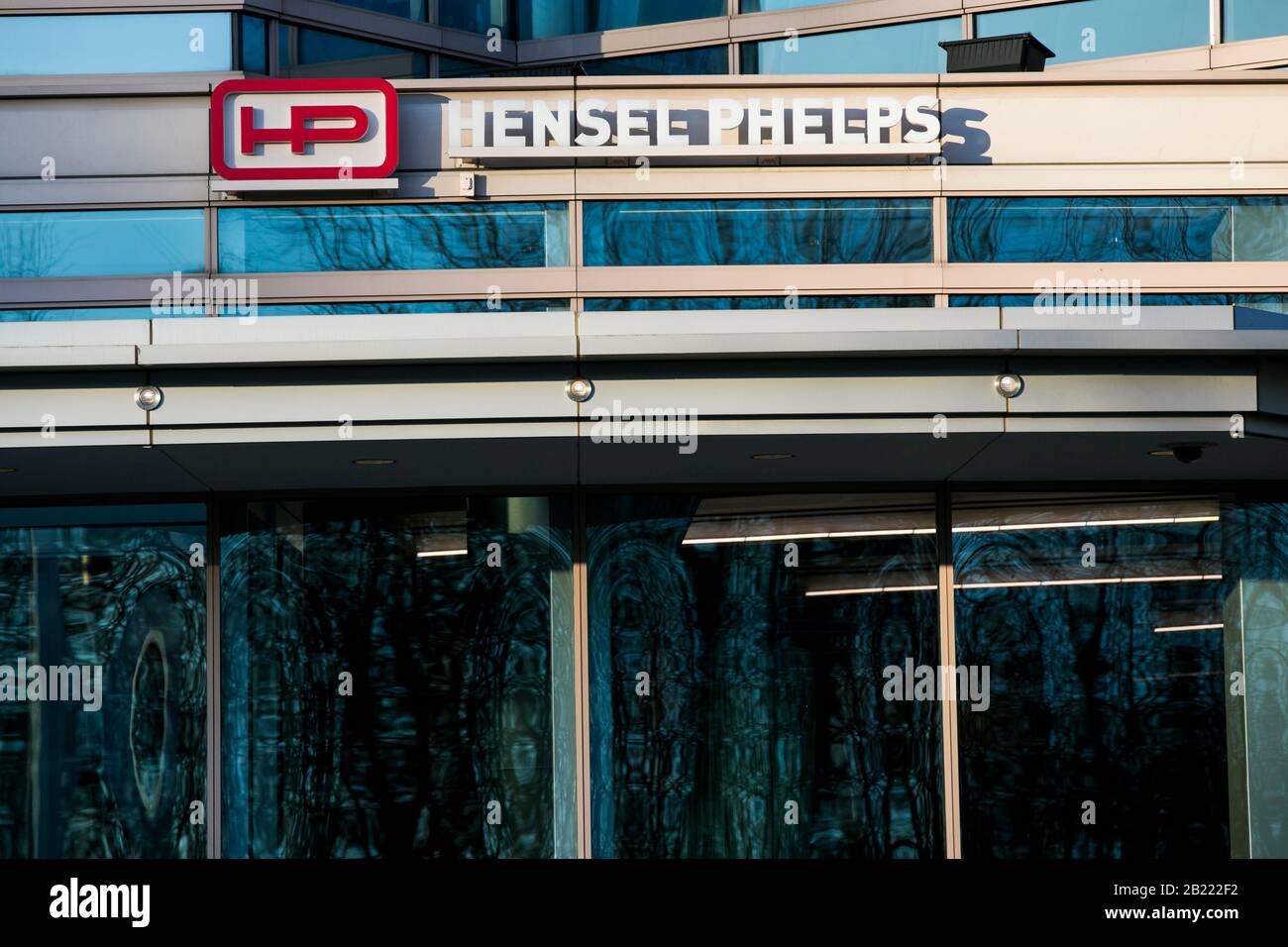 A logo sign outside of a facility occupied by Hensel Phelps in McLean ...