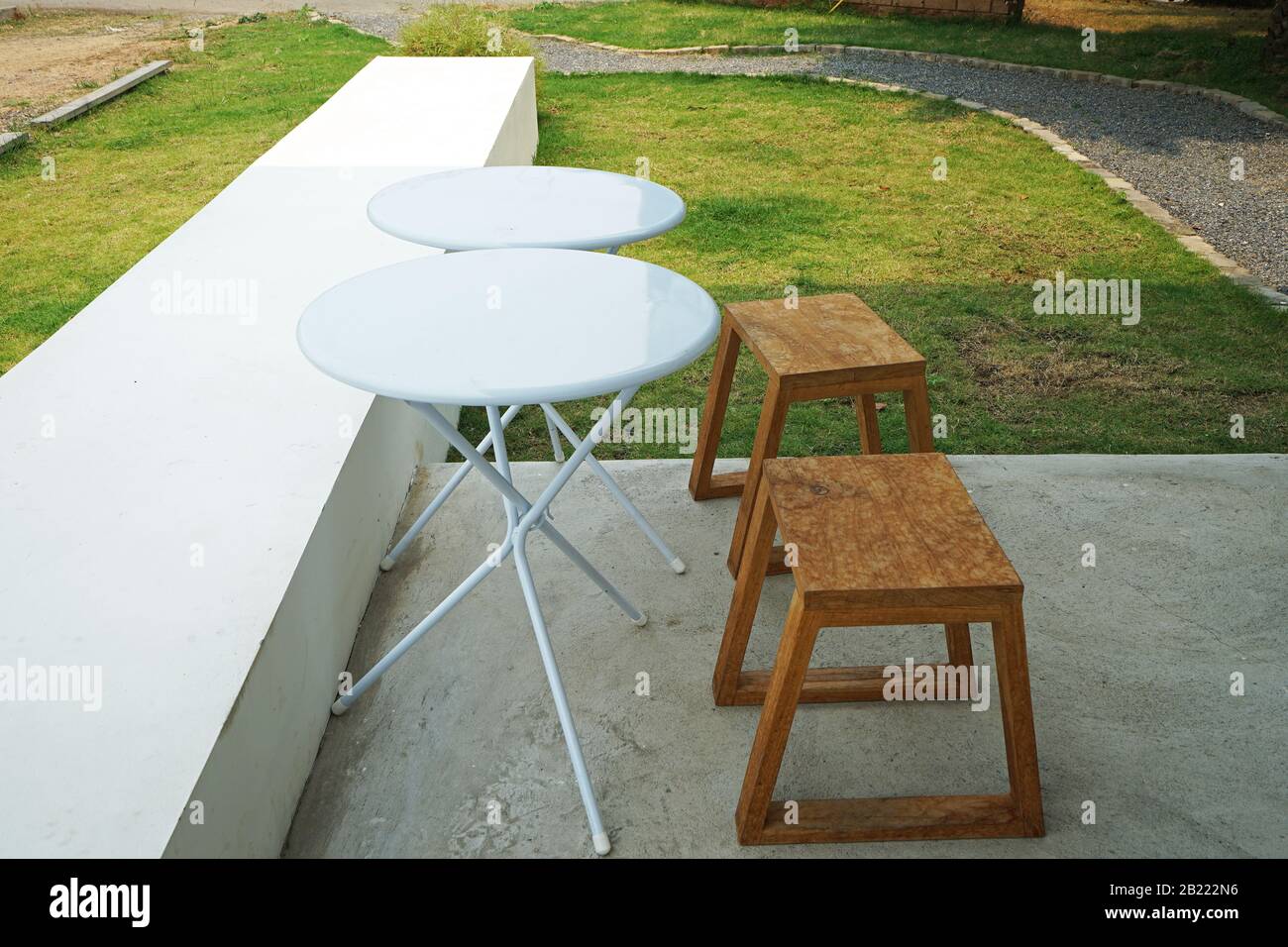 Wooden chairs and foldable desks setting on outdoor terrace patio Stock ...