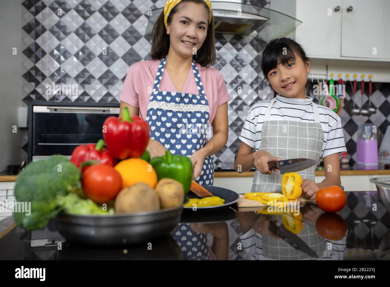 Happy Family have Dad, Mom and their little daughter Cooking Together ...