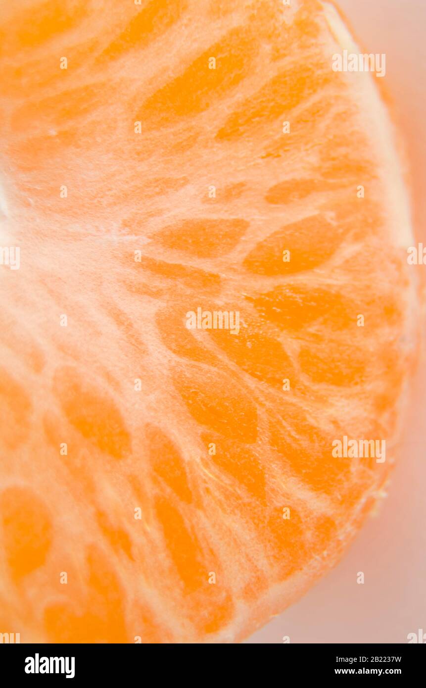 Citrus fruit detail: tangerine piece close-up Stock Photo - Alamy