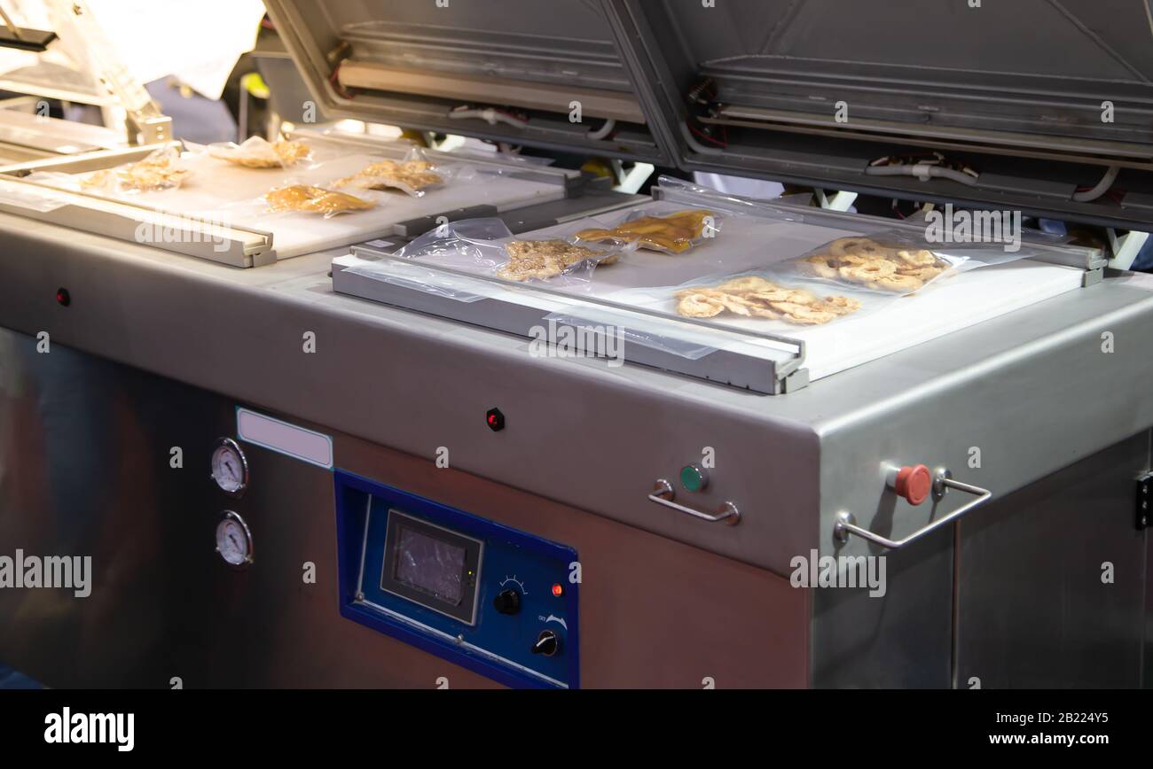 Heat sealing vacuum machine for food packaging Stock Photo - Alamy
