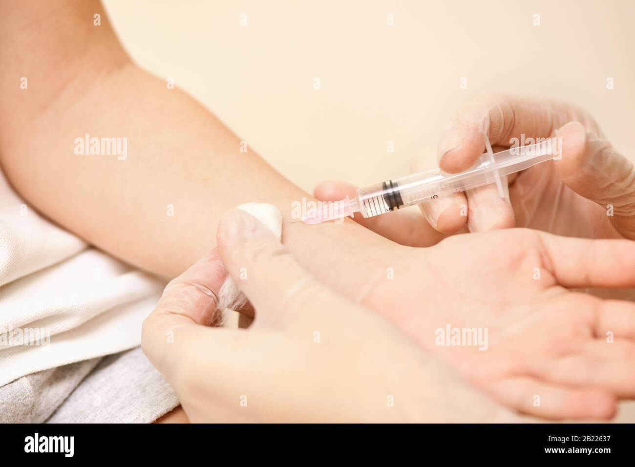 Doctor do injection to young girl. Kid immunization Stock Photo - Alamy