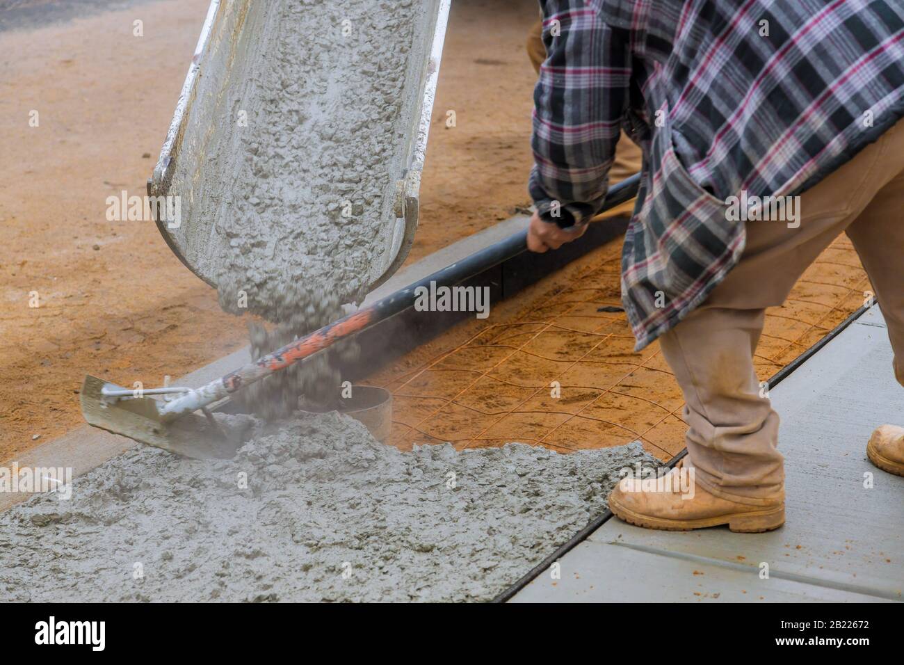 Building new concrete pavement for paving walkway to residential street ...