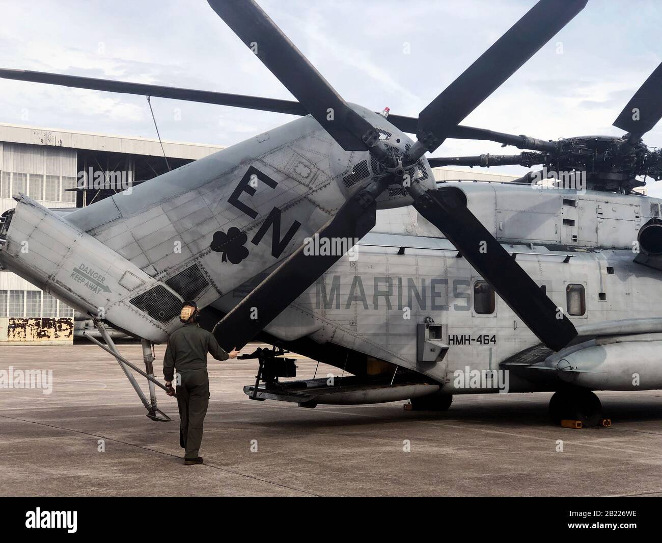 A U.S. Marine assigned to Marine Heavy Helicopter Squadron 464 folds ...