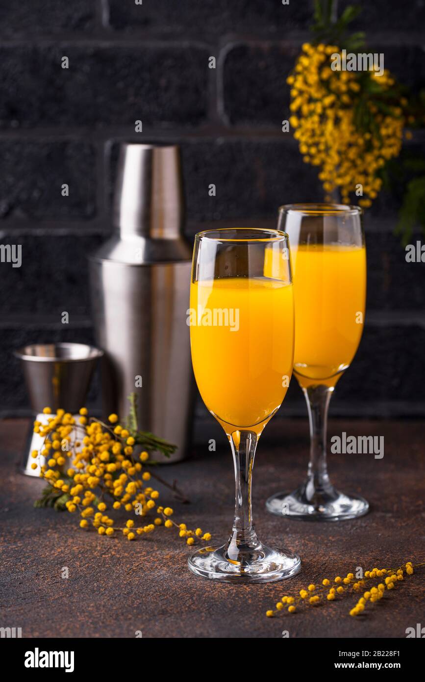 Mimosa cocktail with orange juice Stock Photo - Alamy