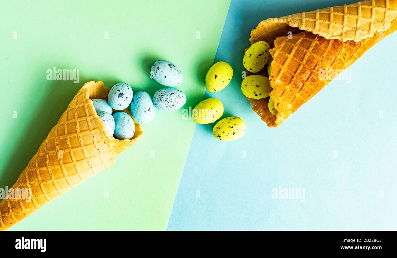 Easter card concept with waffle cone full of easter eggs pastel color ...
