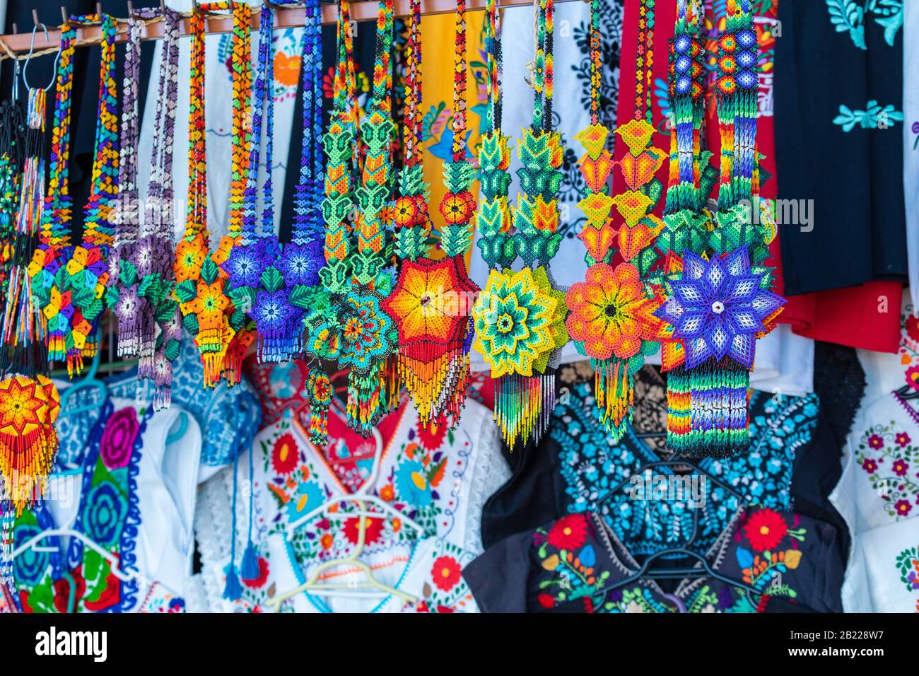 Colorful Mexican souvenirs for sale at local market, Latin America ...