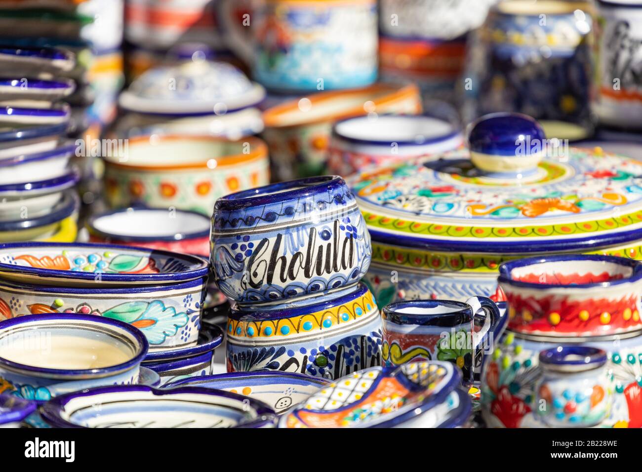 Colorful traditional Mexican pottery. Talavera style. Souvenirs on sale ...