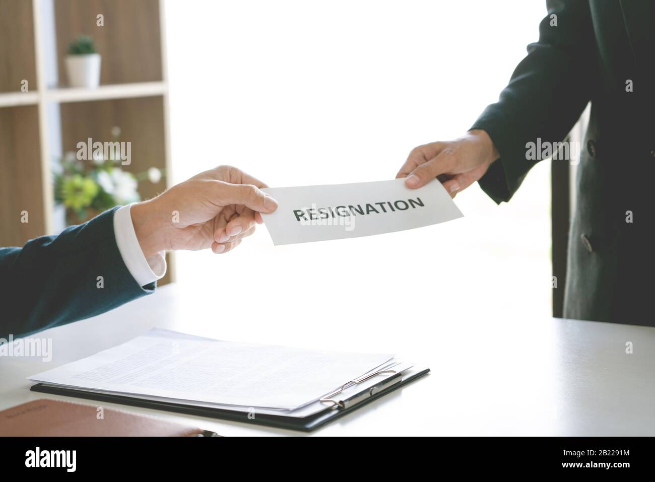 Employee businessman submit or sending resignation document letter to ...