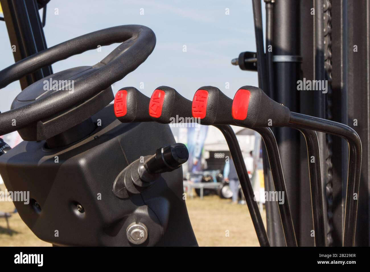 Operating control panels or levers and steering wheel in forklift or ...