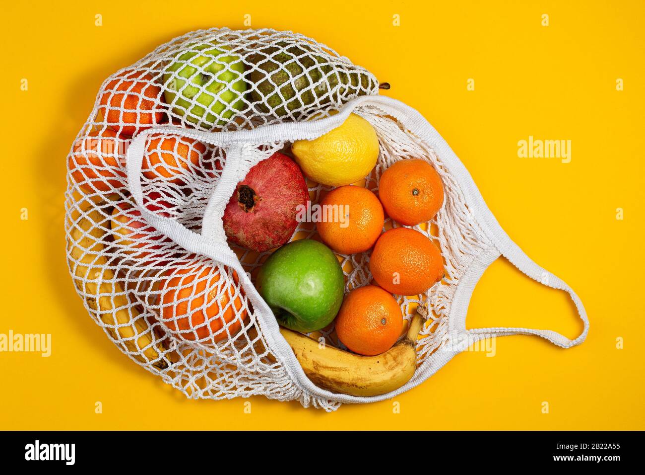 Zero waste plastic free concept. Fresh fruit in a mesh net bag, top ...