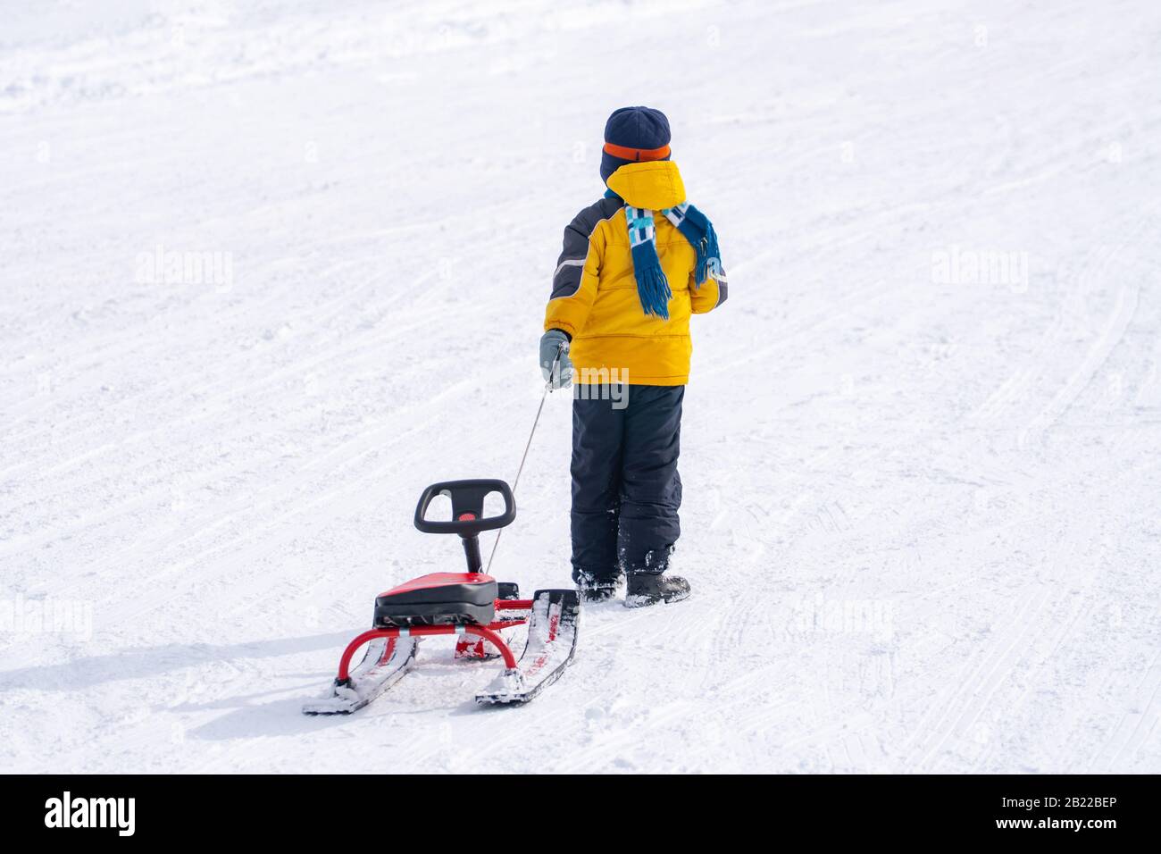 Girl pulling sledge up hill hi-res stock photography and images - Alamy