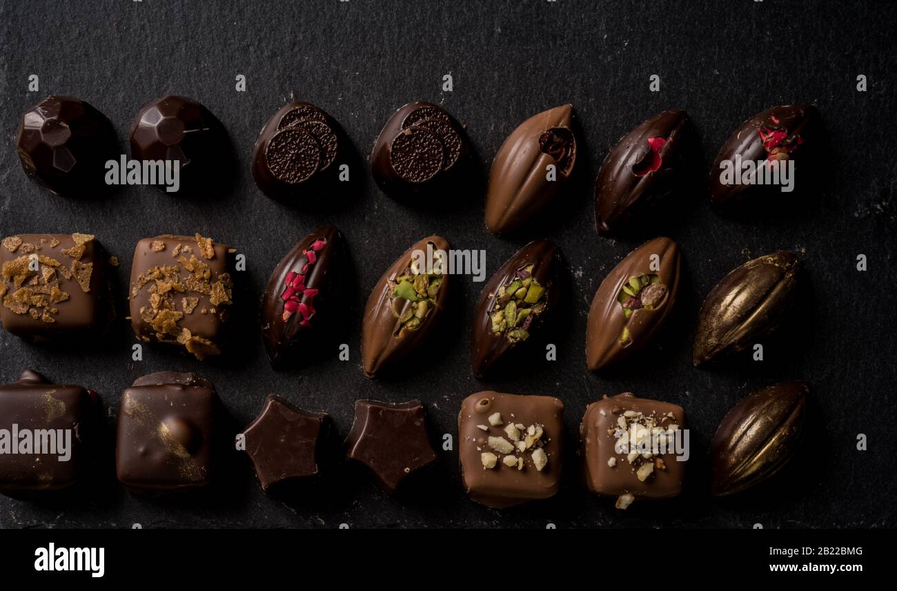 Homemade Belgian chocolates on dark background Stock Photo - Alamy